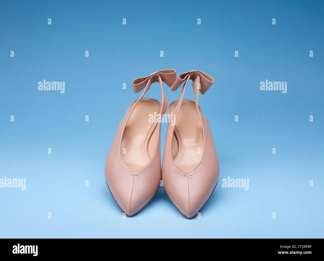 Feminine summer pointed-toe open-back shoes with bows on the back ...