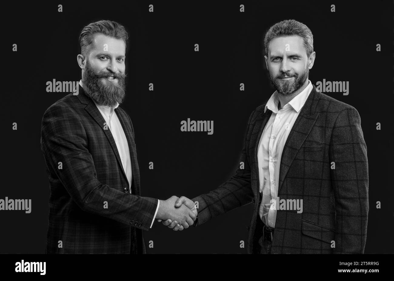 cheerful men deal with handshake on background. photo of men deal with ...