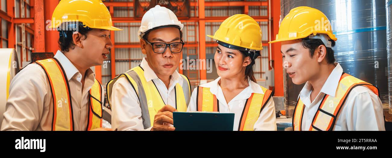 Team of engineers conduct safety inspection on machinery and ...