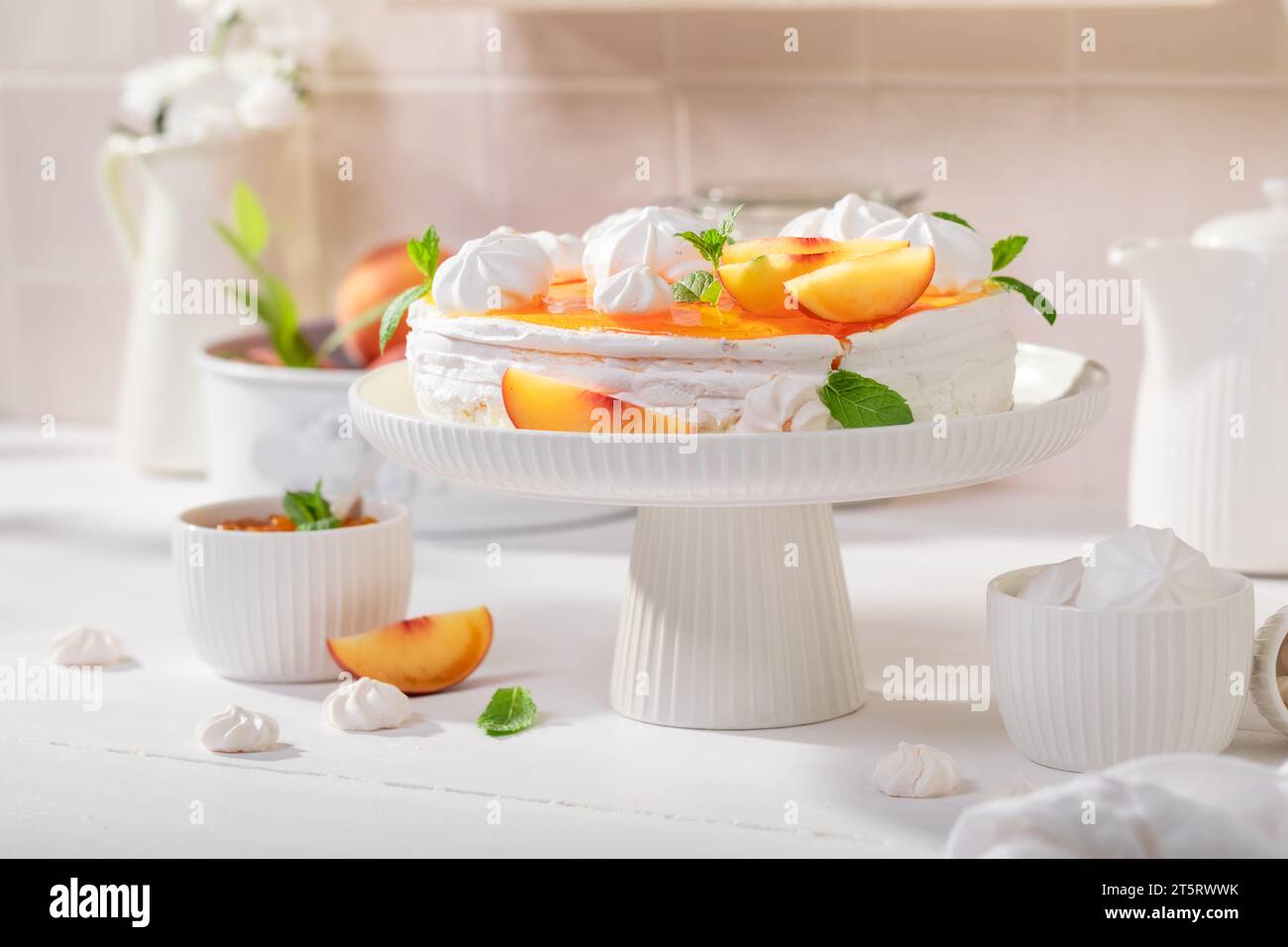 Tasty peach meringue served as spring dessert. Peach meringue with ...