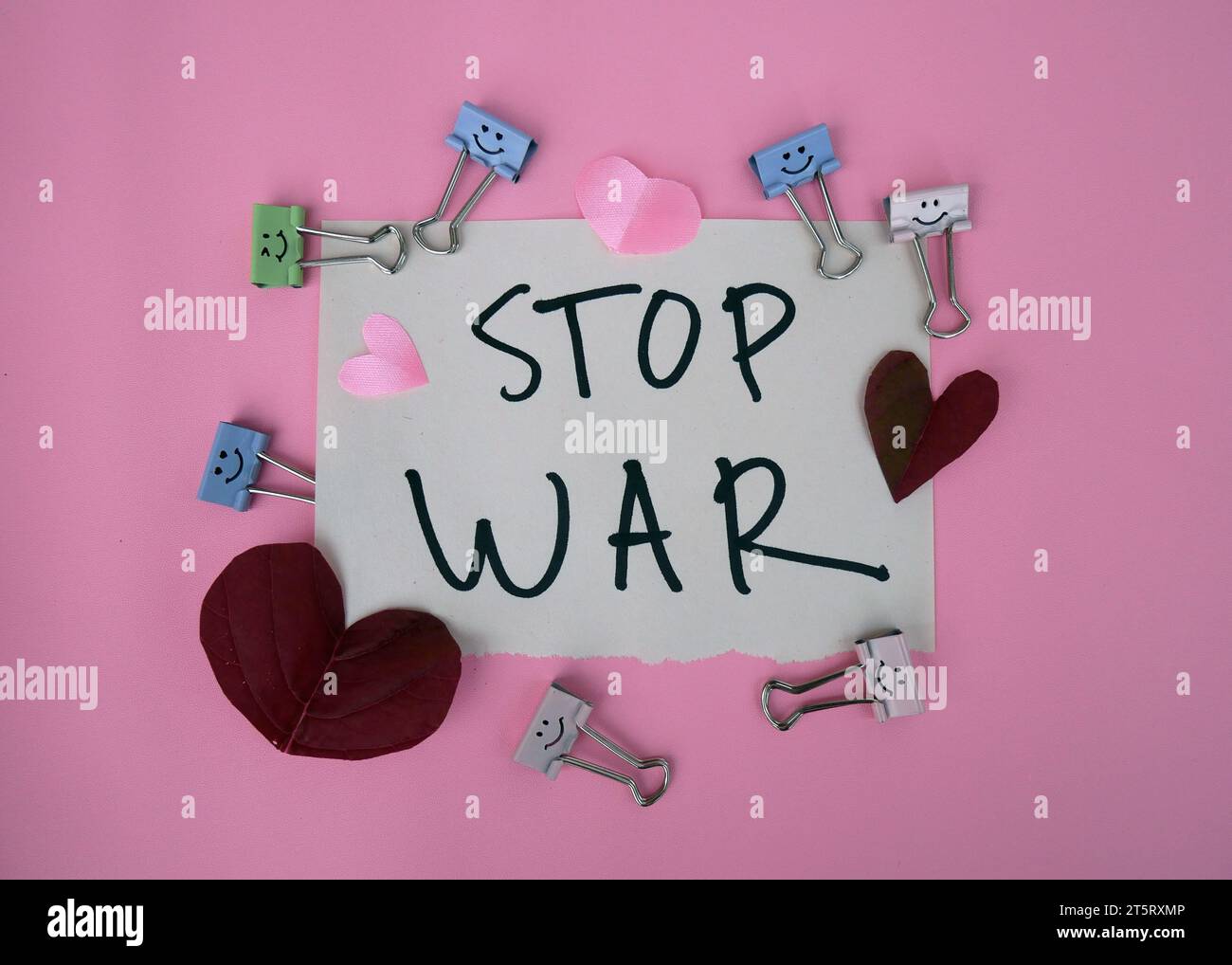 Text messages stop the war with a small pink heart. STOP WAR written on ...