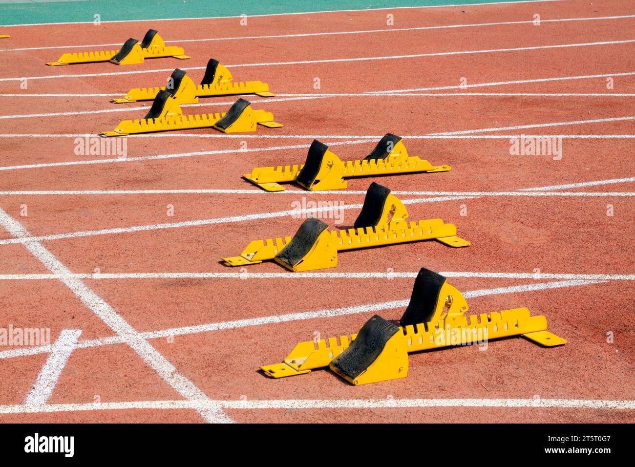 yellow starting block and athletes, closeup of photo Stock Photo - Alamy