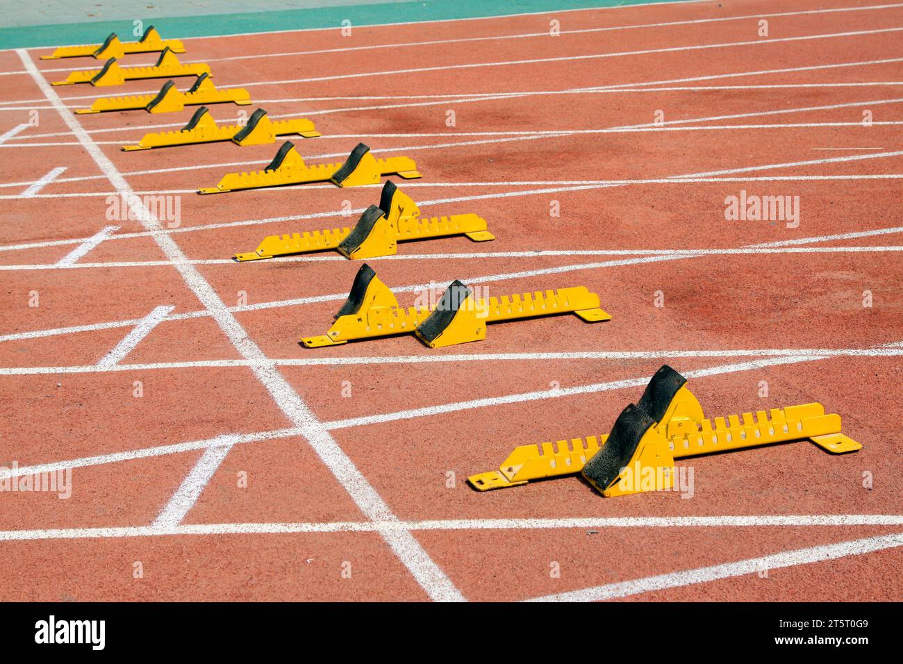 yellow starting block and athletes, closeup of photo Stock Photo - Alamy
