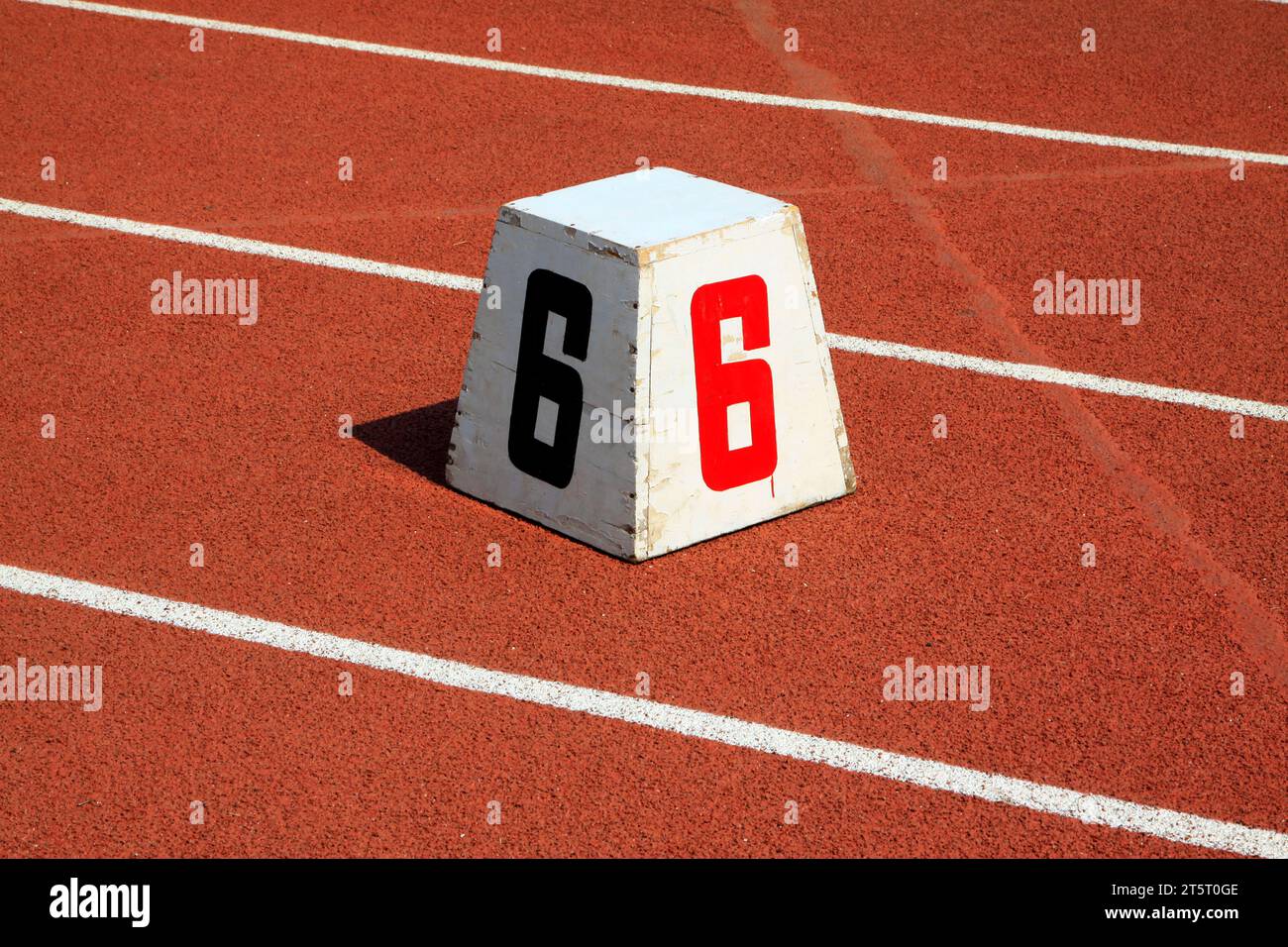 Wooden track number mark on the plastic runway, closeup of photo Stock ...