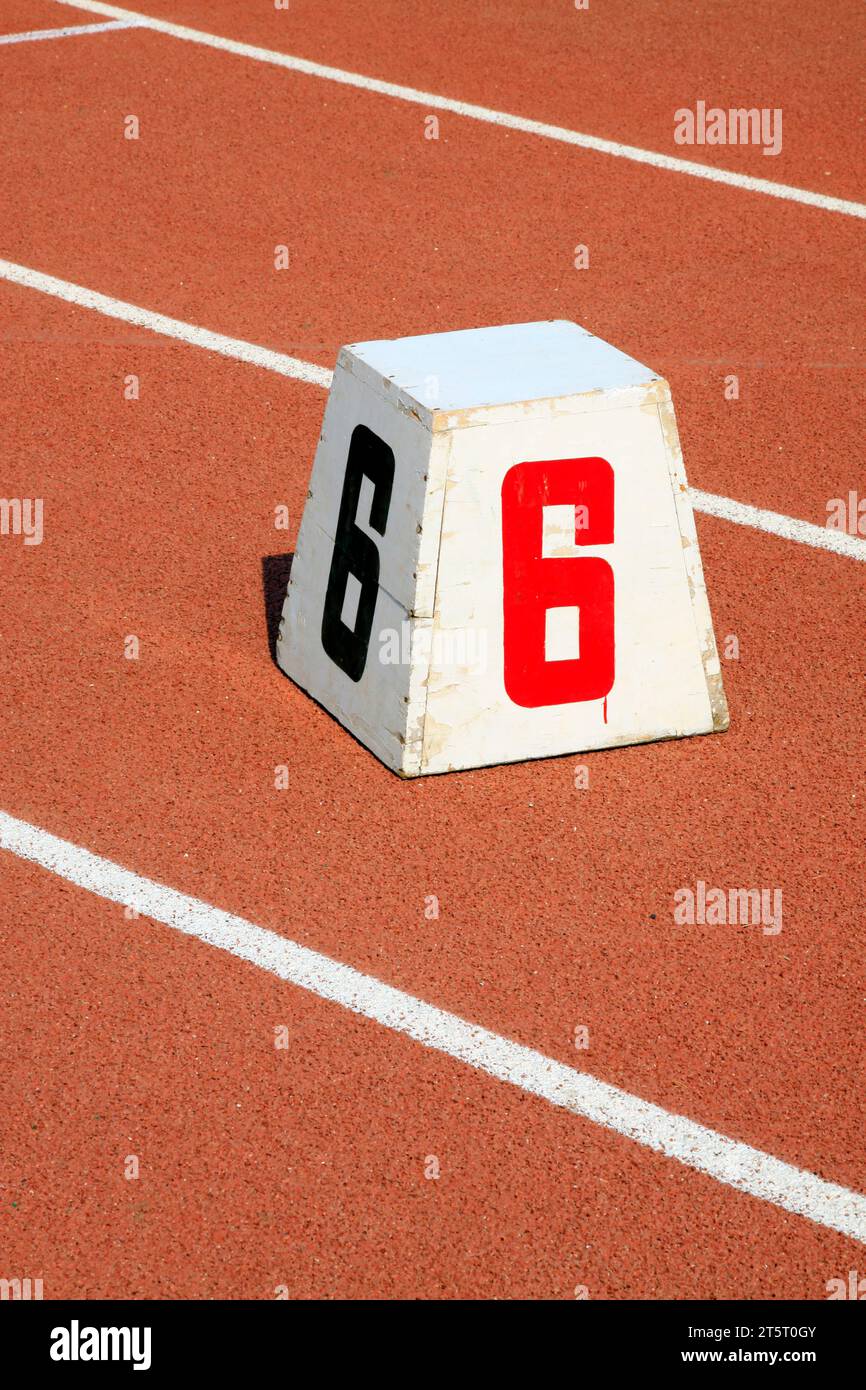 Wooden track number mark on the plastic runway, closeup of photo Stock ...