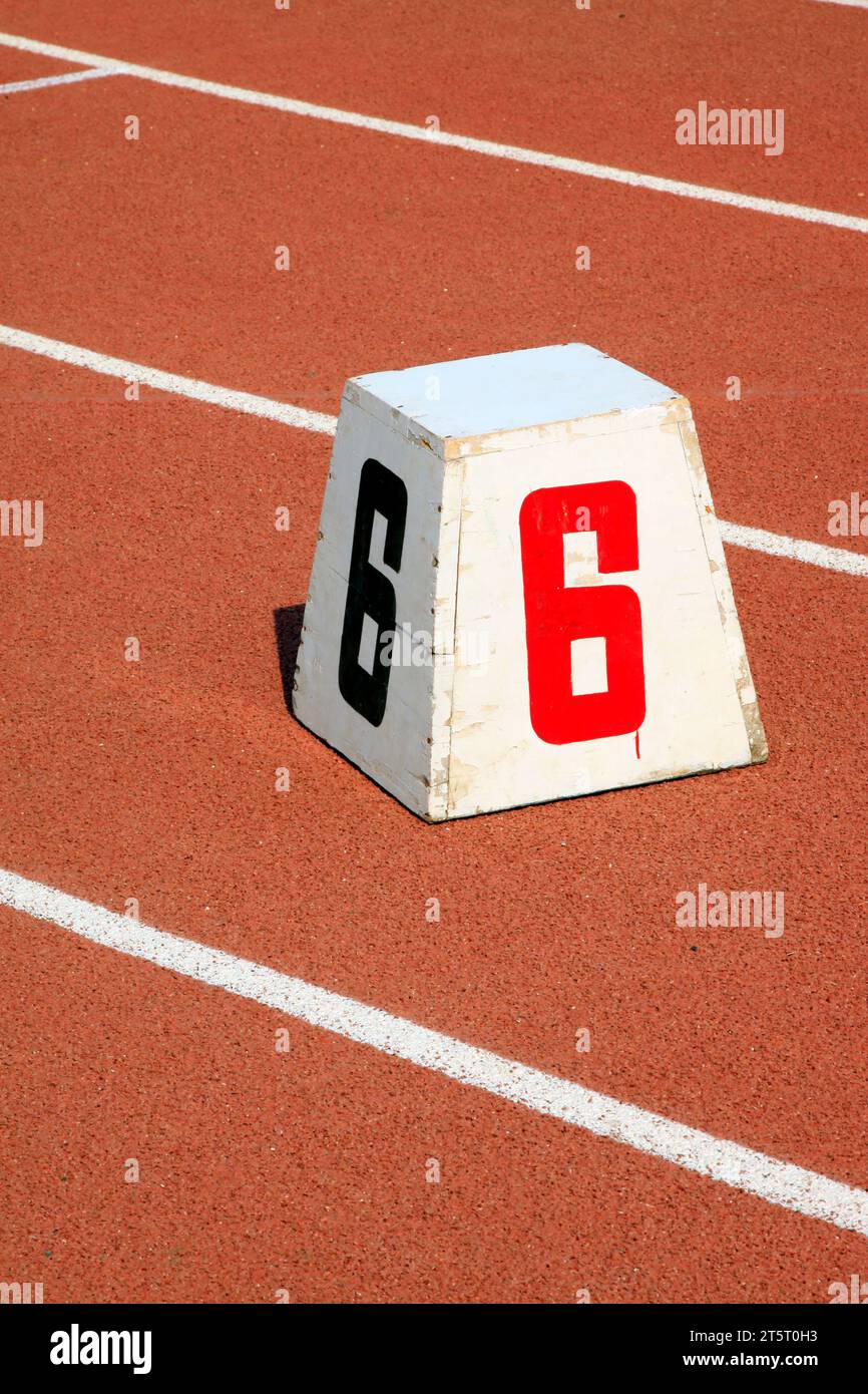Wooden track number mark on the plastic runway, closeup of photo Stock ...