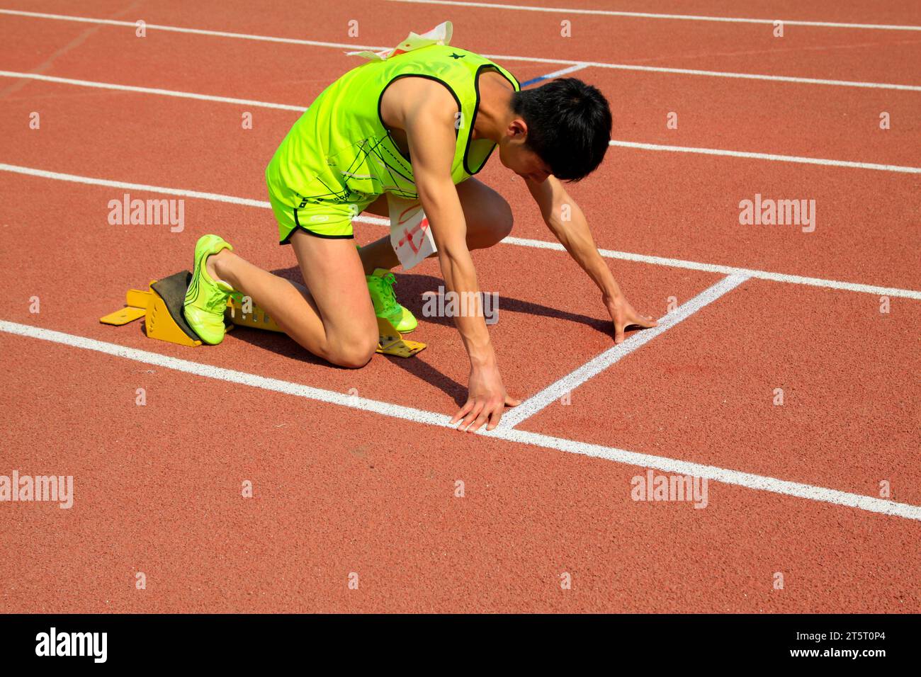 LUANNAN COUNTY - APRIL 14: short distance runner ready to start, April ...