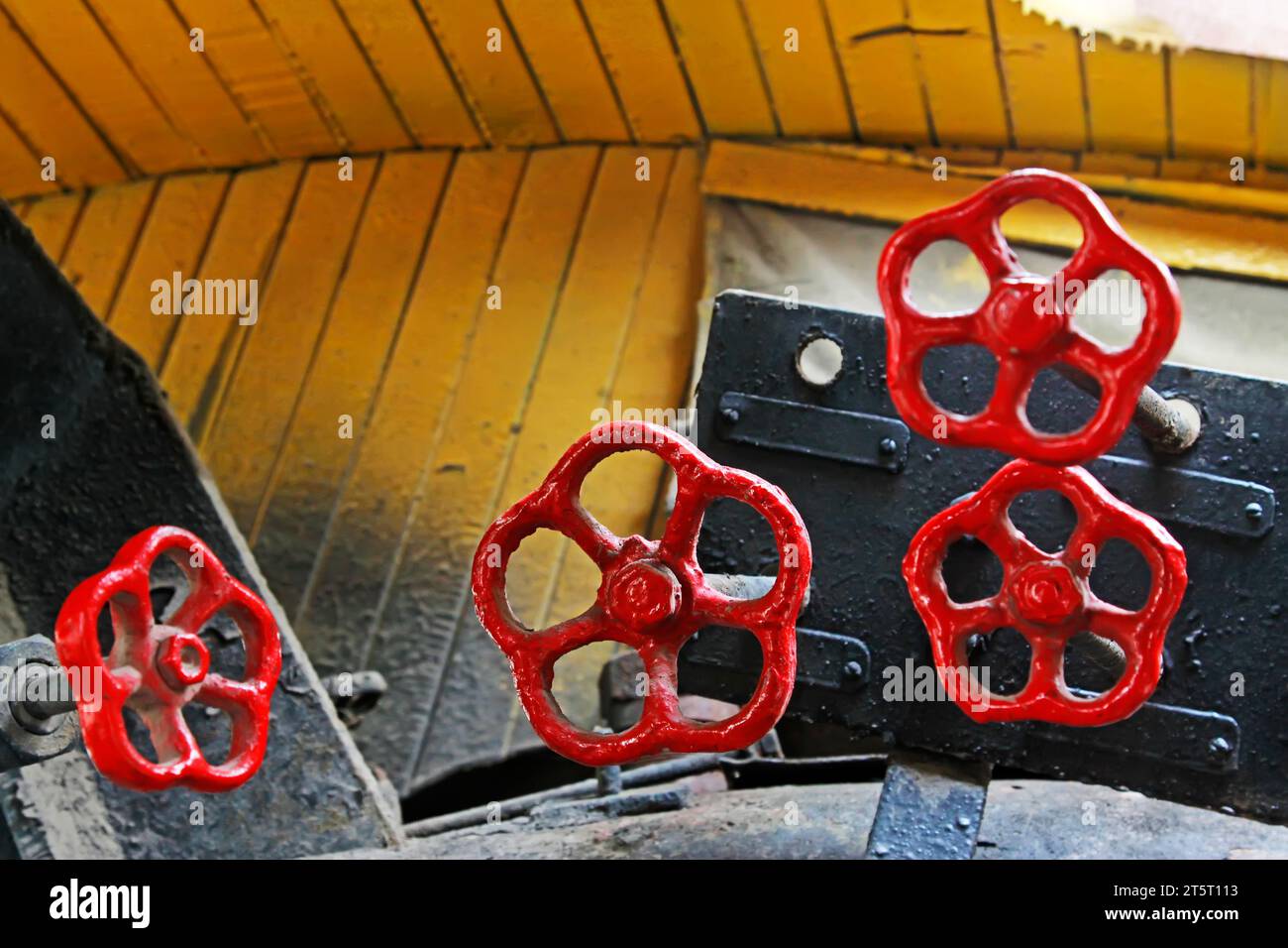 red handwheel in steam locomotive cab, closeup of photo Stock Photo - Alamy
