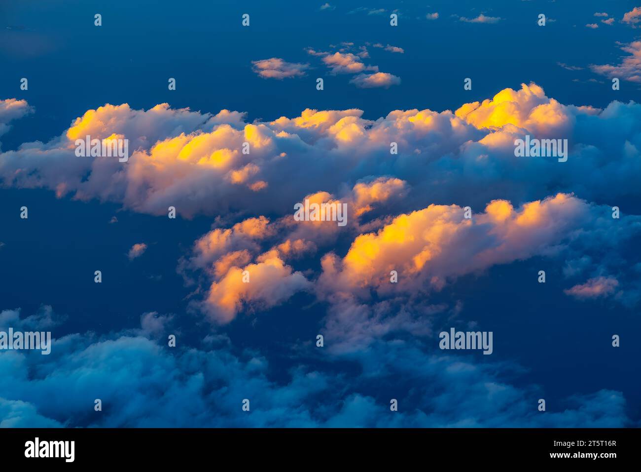 Billowing clouds stretch over the endless expanse of the ocean. The ...