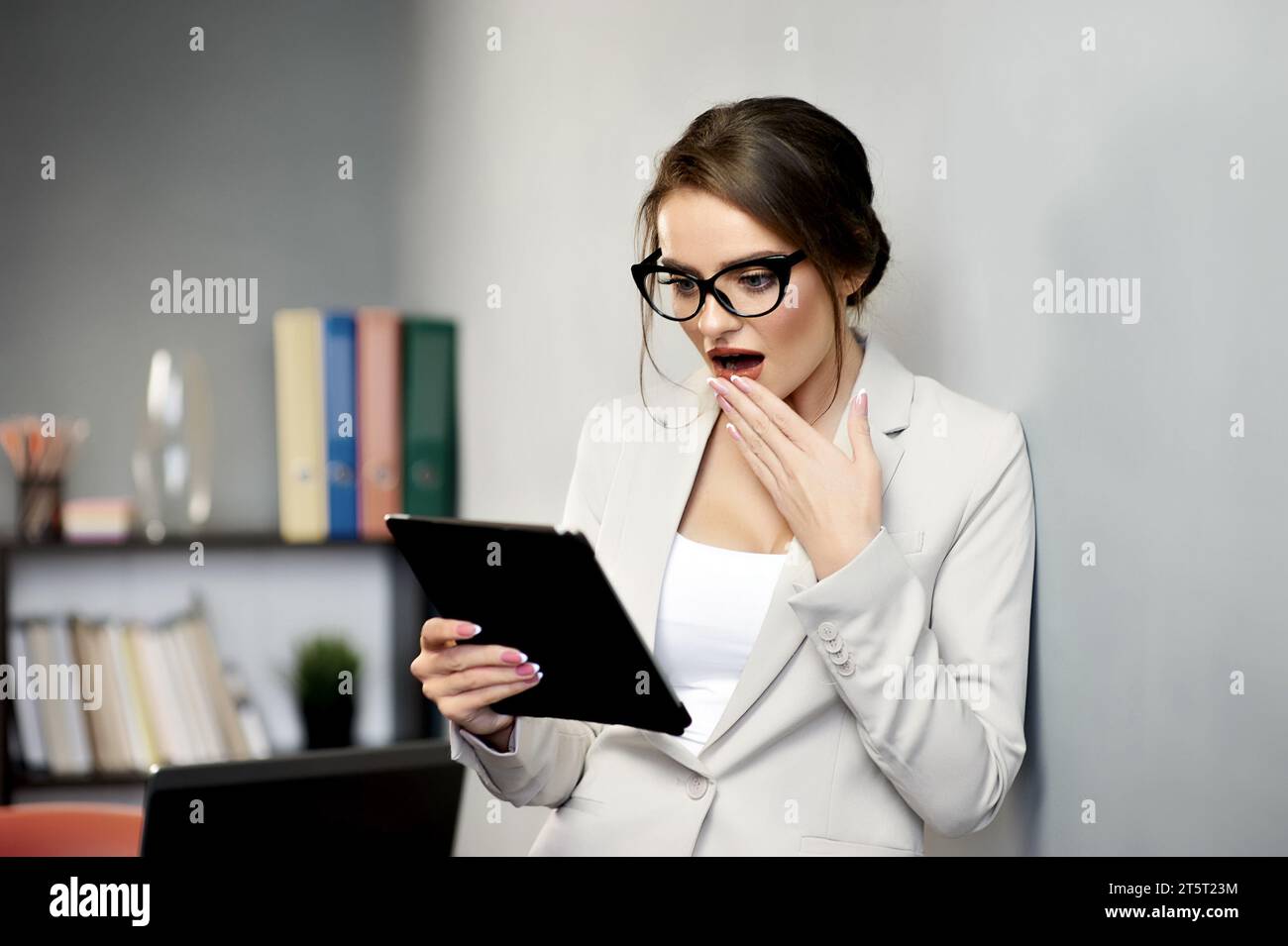 Pretty astonished girl using hi-res stock photography and images - Alamy