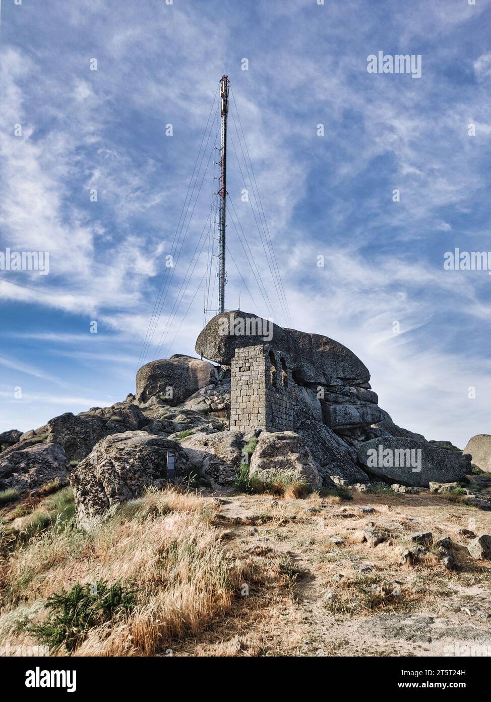A breathtaking view of the famous Monsanto Castle in Portugal, atop a ...