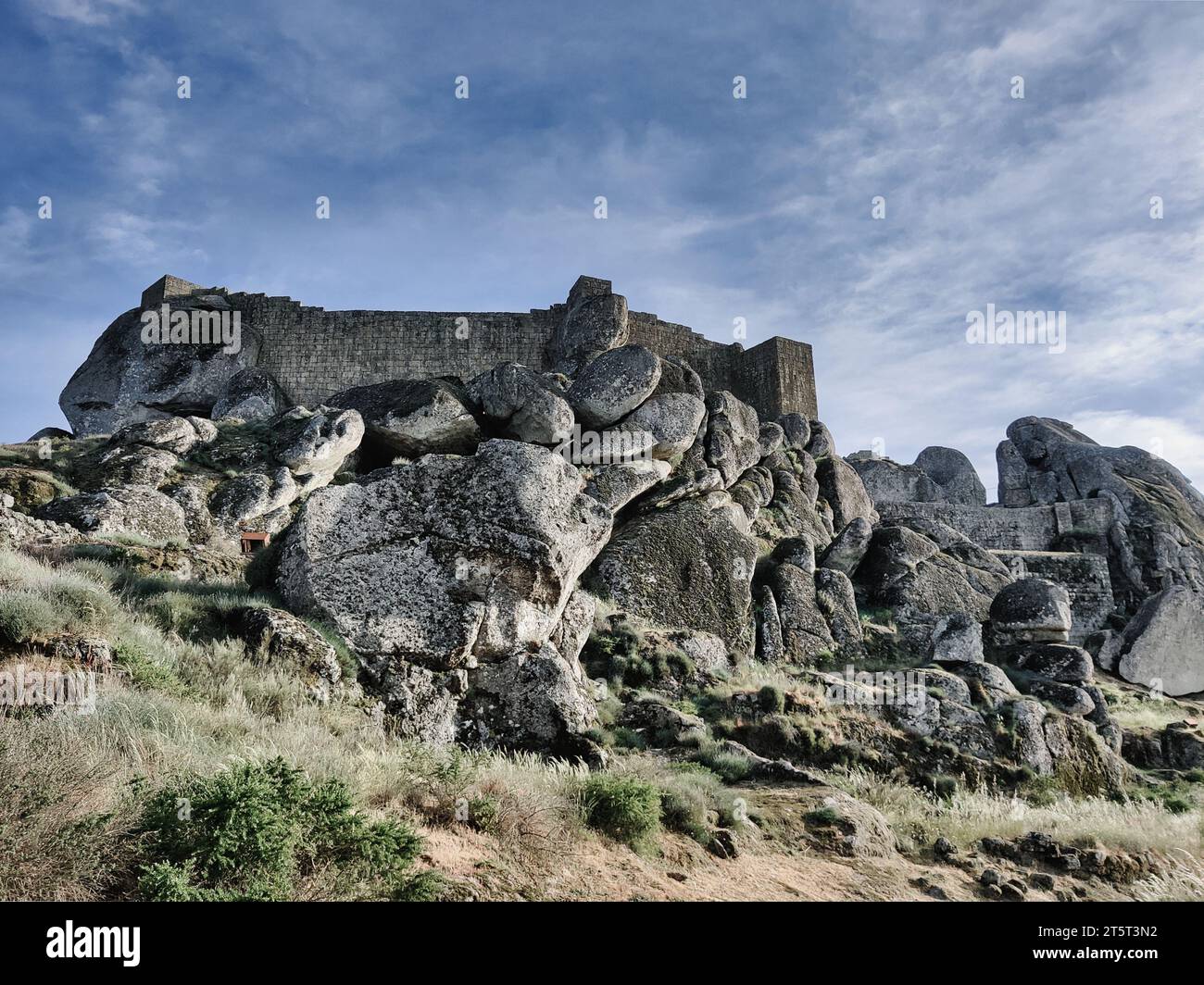 A breathtaking view of the famous Monsanto Castle in Portugal, atop a ...