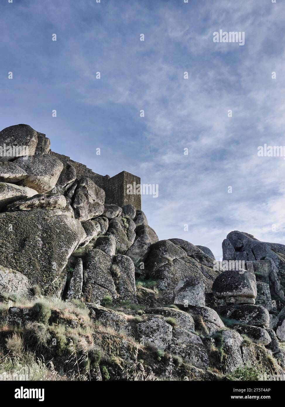 A breathtaking view of the famous Monsanto Castle in Portugal, atop a ...
