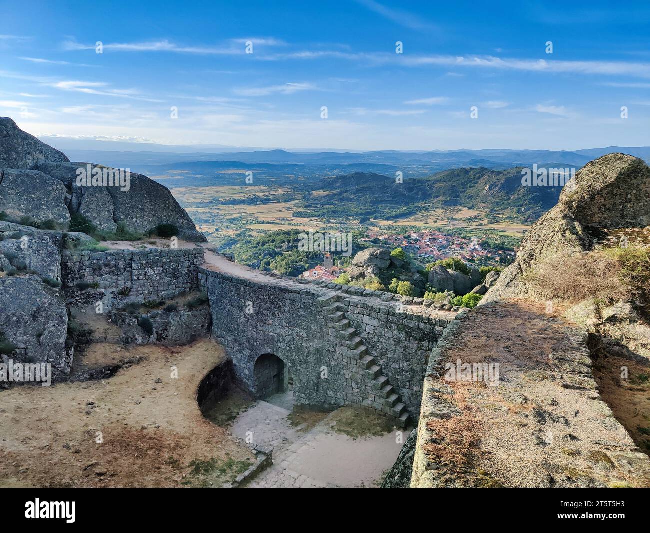 A breathtaking view of the famous Monsanto Castle in Portugal, atop a ...