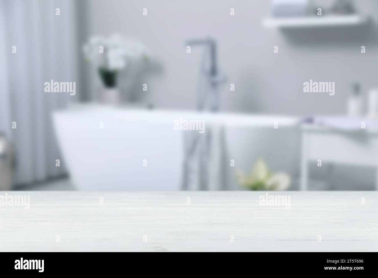 Empty white wooden table in bathroom. Space for design Stock Photo - Alamy
