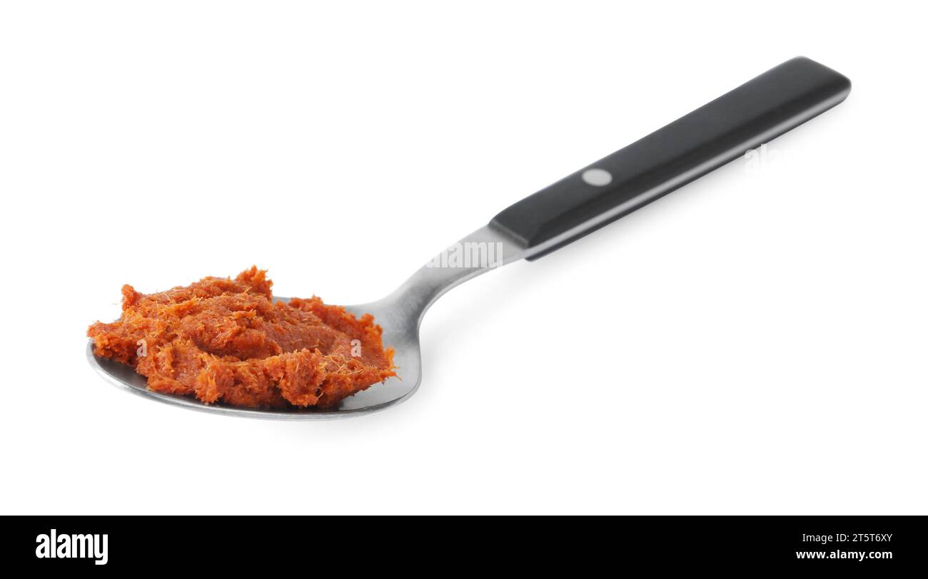 Tasty curry paste in spoon isolated on white Stock Photo - Alamy