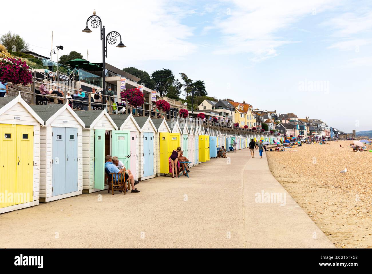 Lyme Regis Dorset, traditional English seafront beach huts painted in ...