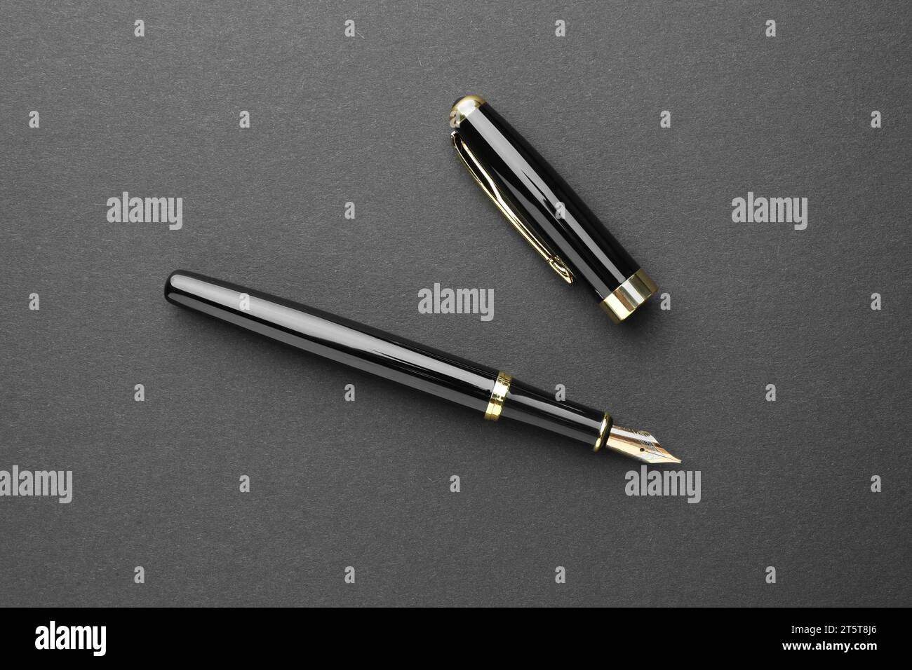 Stylish fountain pen with cap on dark background, flat lay Stock Photo ...