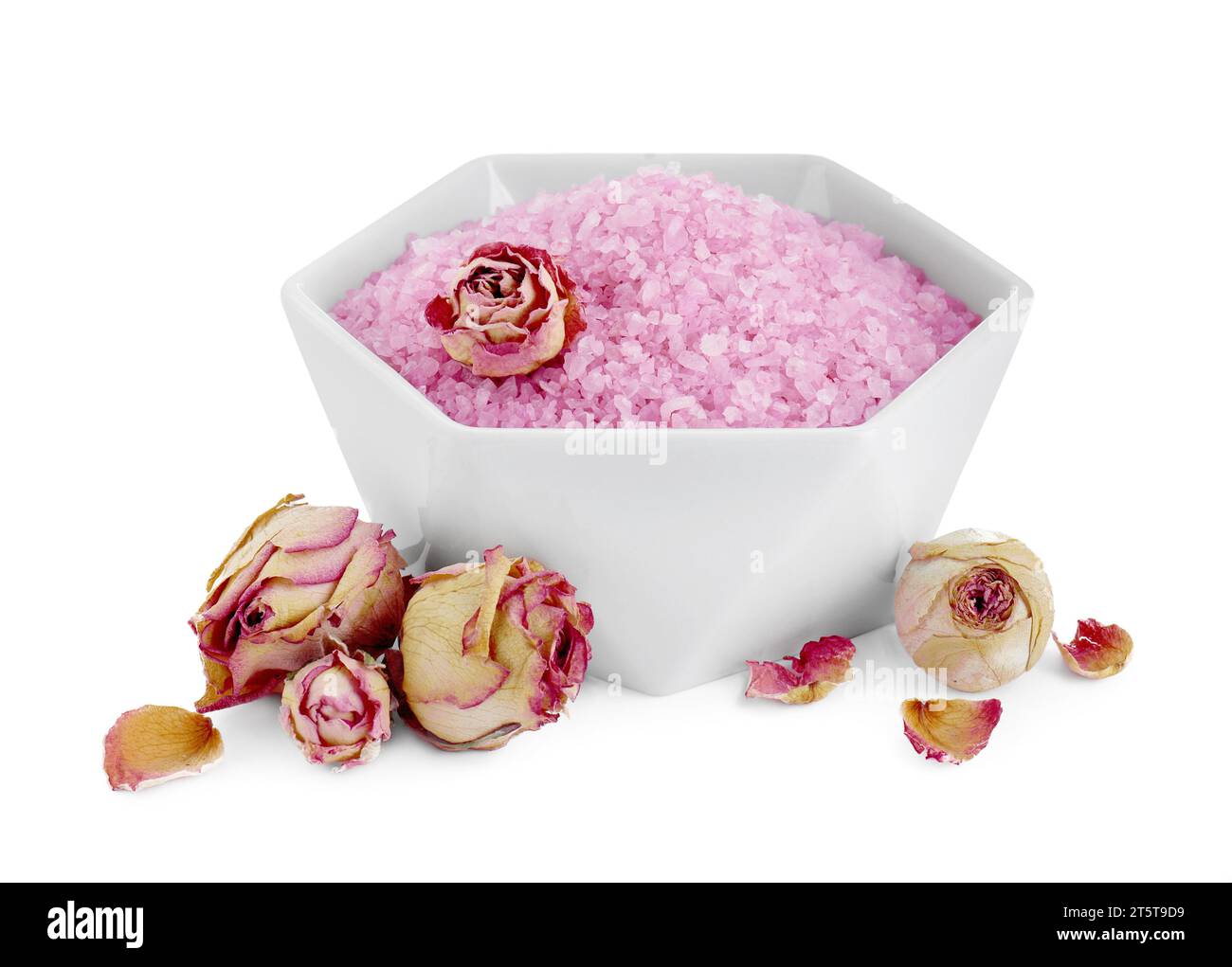Bowl of pink sea salt and dry rose flowers isolated on white Stock ...