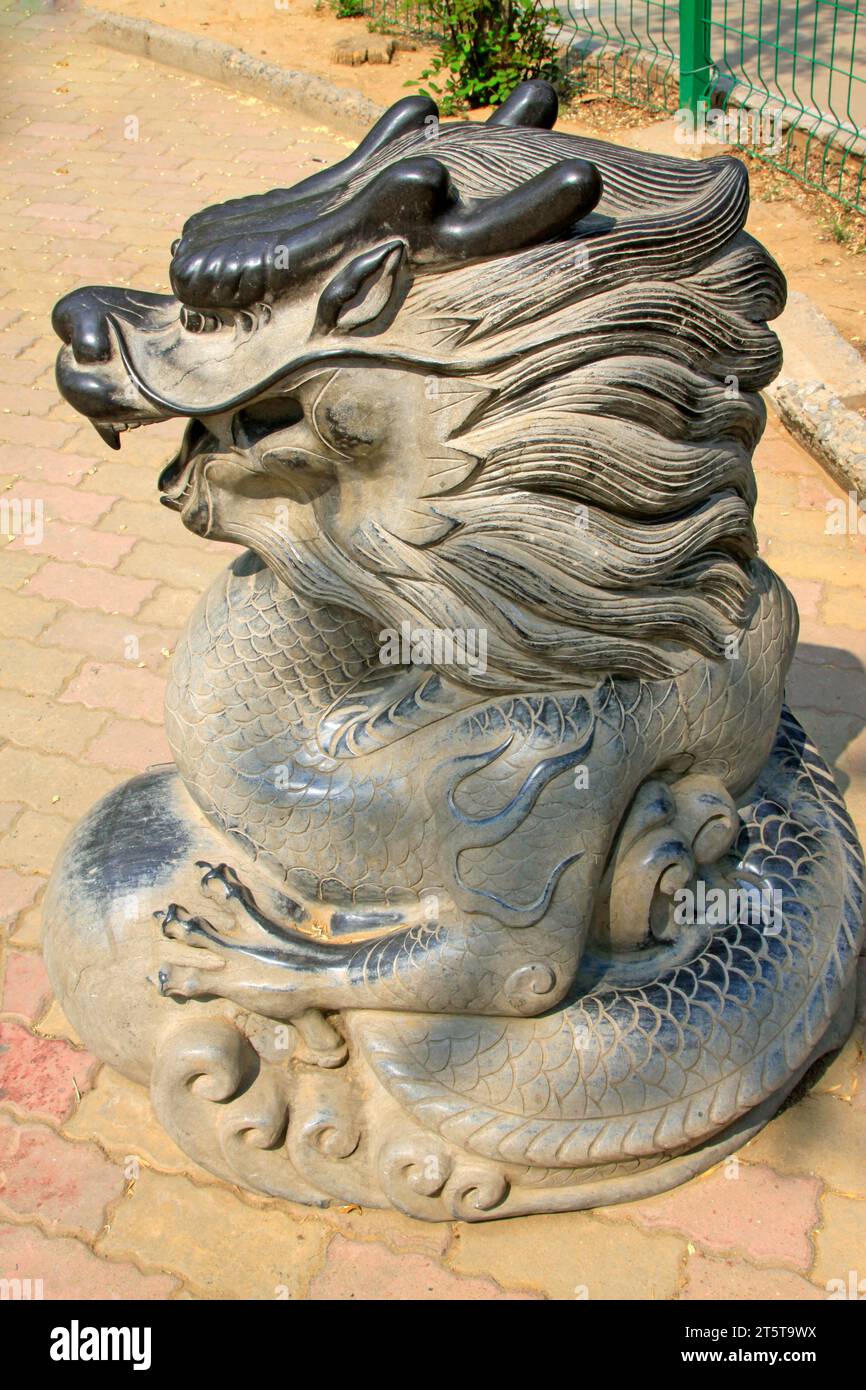 dragon head sculpture in a park, closeup of photo Stock Photo - Alamy