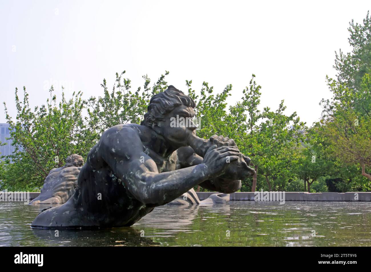 ancient Greek characters sculpture in a water park, closeup of photo ...