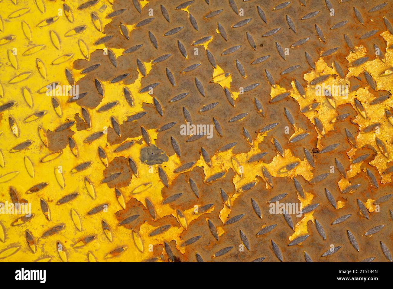 Paint peeling checkered plate, closeup of photo Stock Photo - Alamy