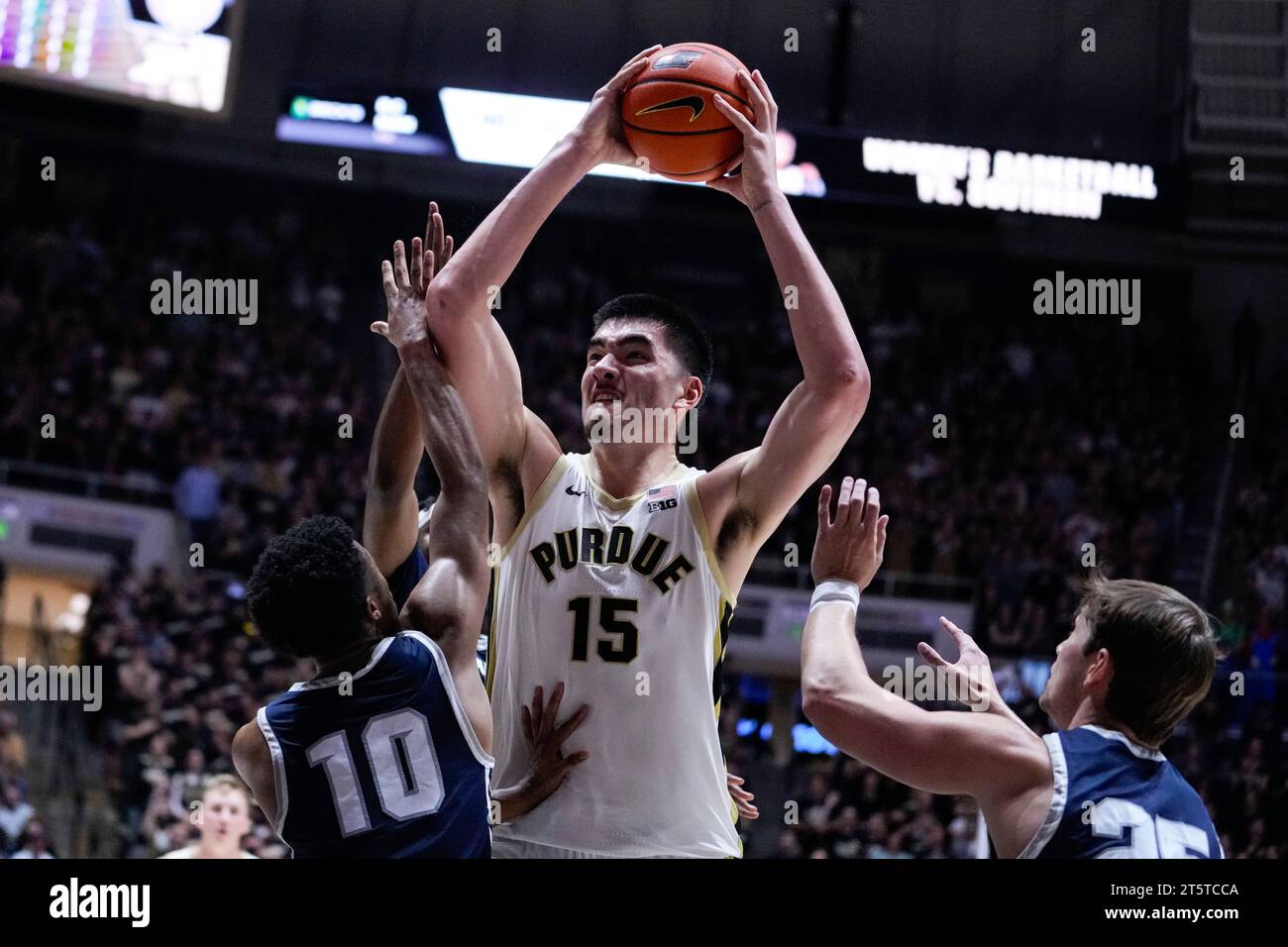 Purdue center Zach Edey (15) shoots between Samford guard Garrett Hicks (10) and forward Nathan ...