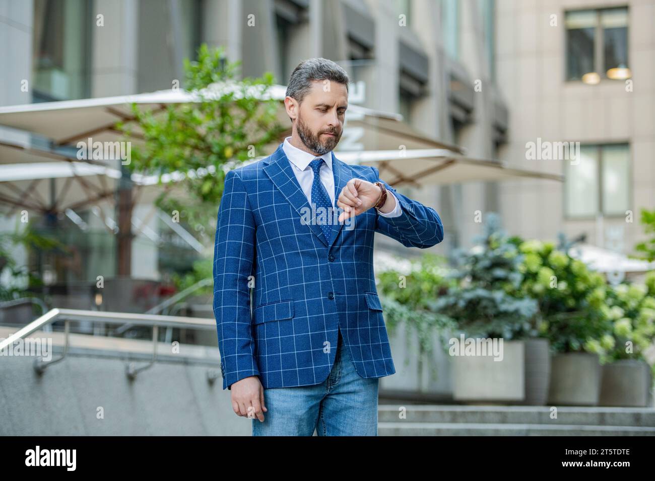 punctual businessman with deadline outside. photo of punctual ...