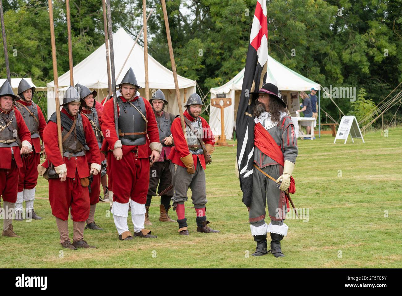 Pikemen getting ready for battle with their ensign flag bearer in front ...