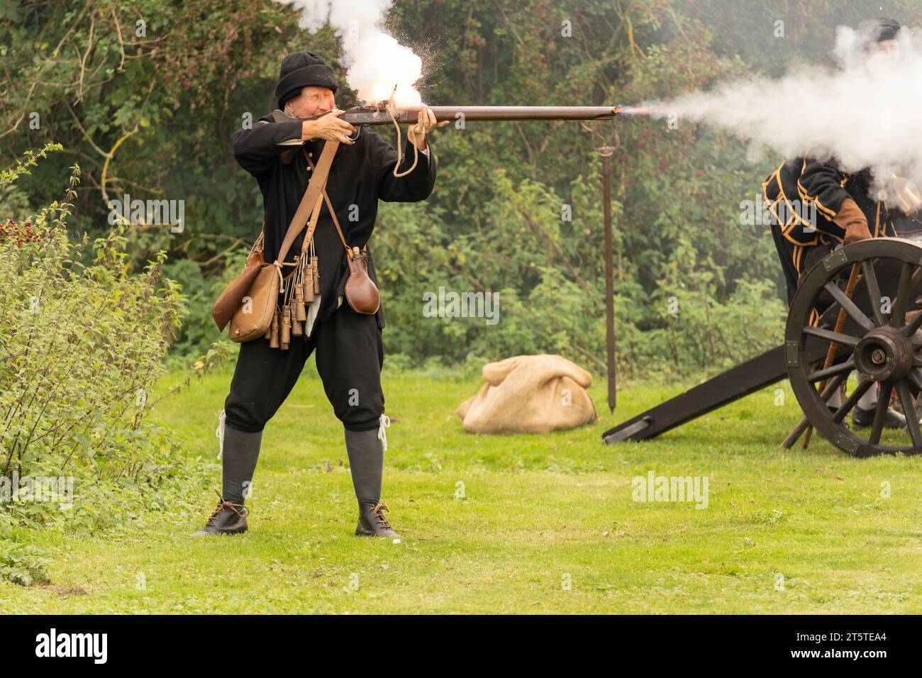 A musketeer firing a flintlock musket - the Siege of Basing House, from ...