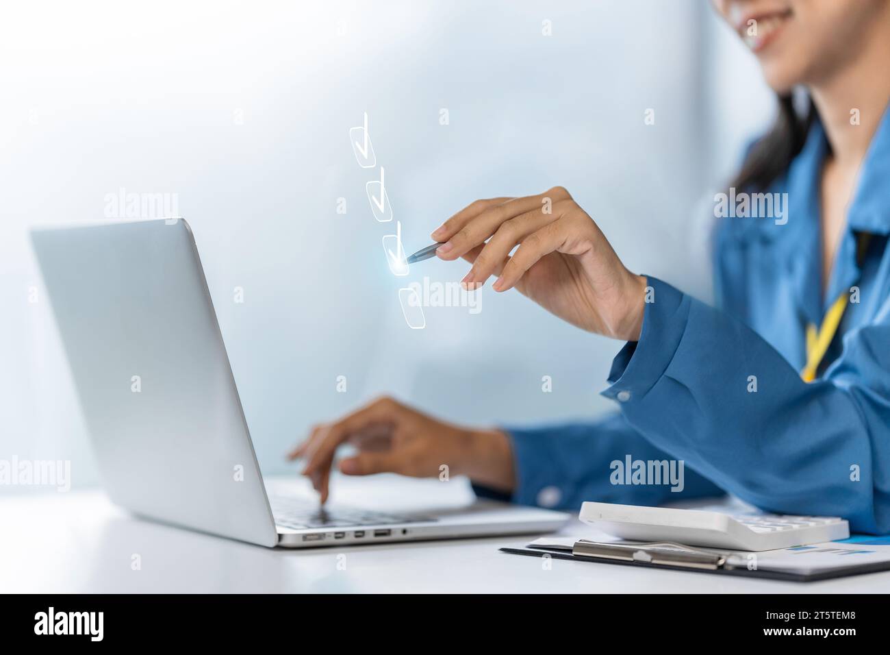 Businesswoman use pen to tick correct sign mark in checkbox for quality ...