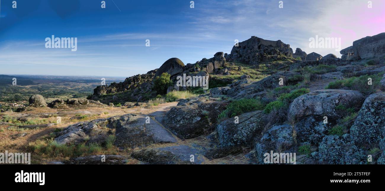 A breathtaking view of the famous Monsanto Castle in Portugal, atop a ...