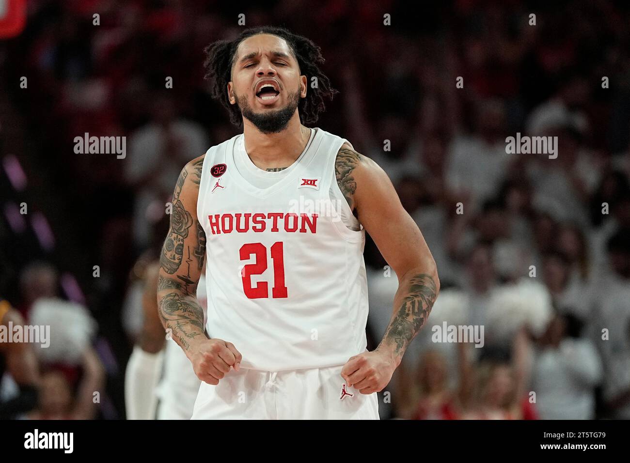 Houston guard Emanuel Sharp (21) celebrates after hitting a 3-pointer ...