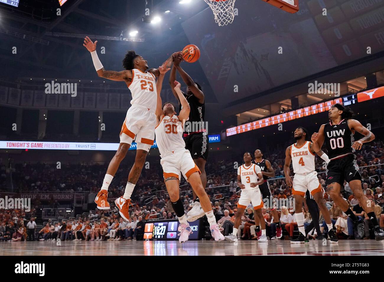 Texas forward Dillon Mitchell (23) and forward Brock Cunningham (30 ...