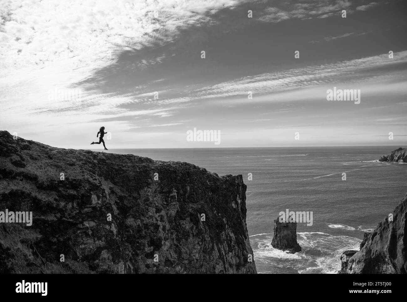 free woman runner running on the cliff. freedom and motivation Stock ...