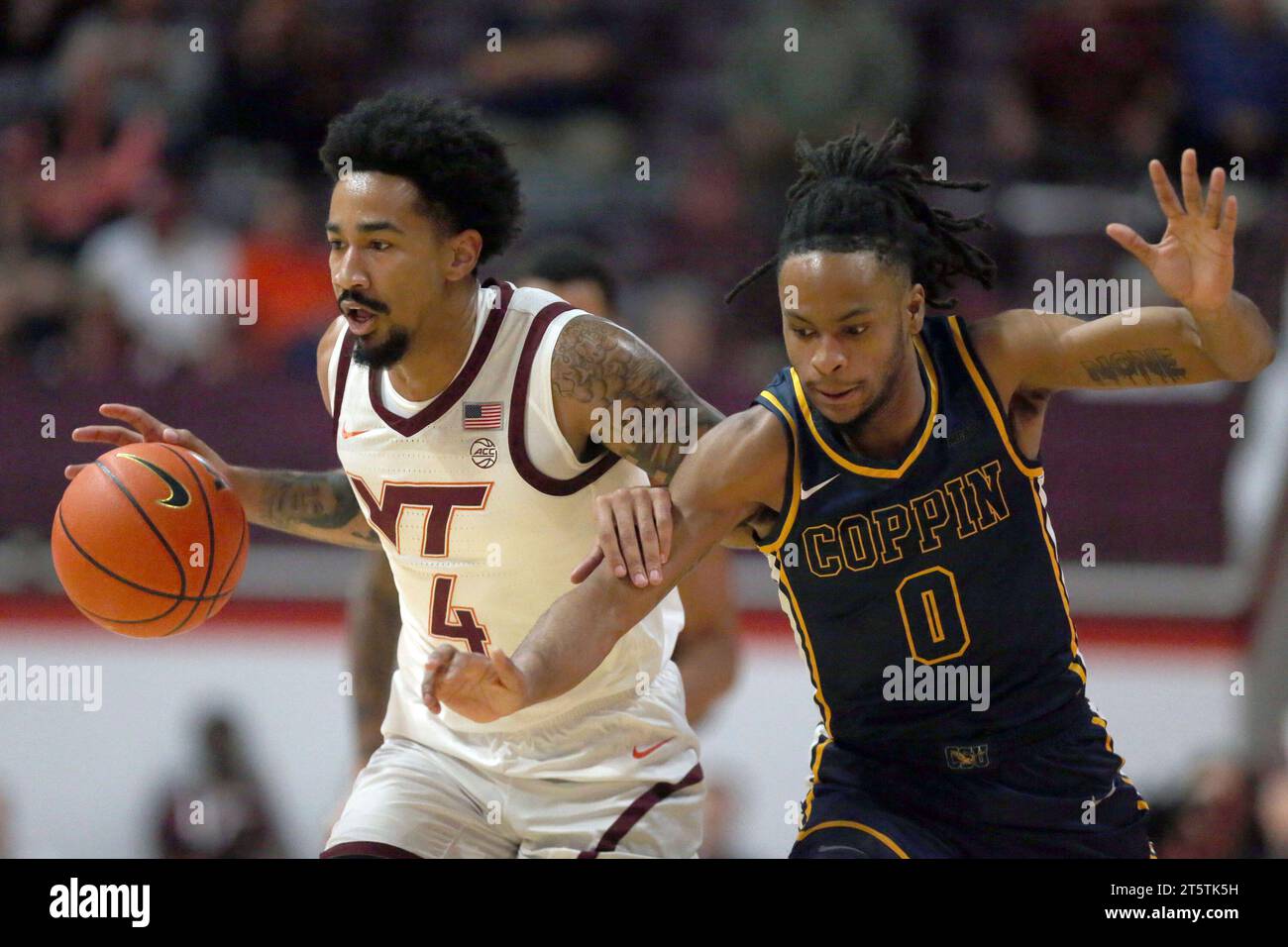 Virginia Tech's Mekhi Long (4) is defended by Coppin State's Malik ...