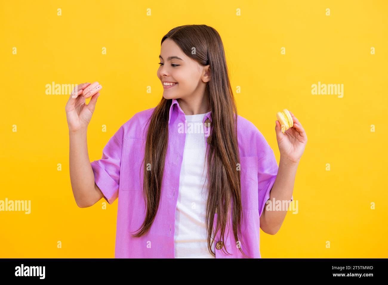 Sweet tooth girl eat macaron. french yummy cookie. french cookie of ...