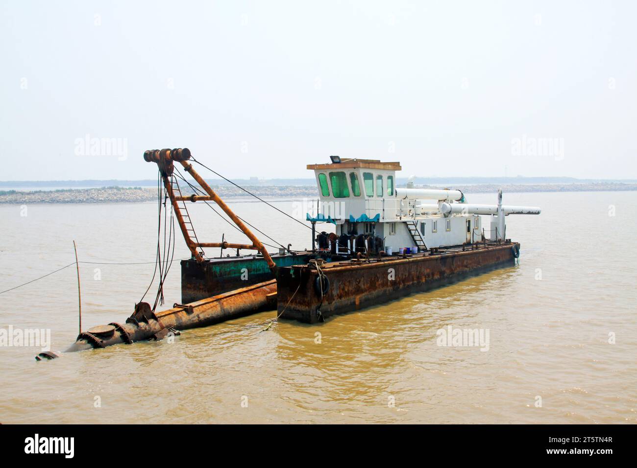 Sand mining ship on the shore Stock Photo - Alamy