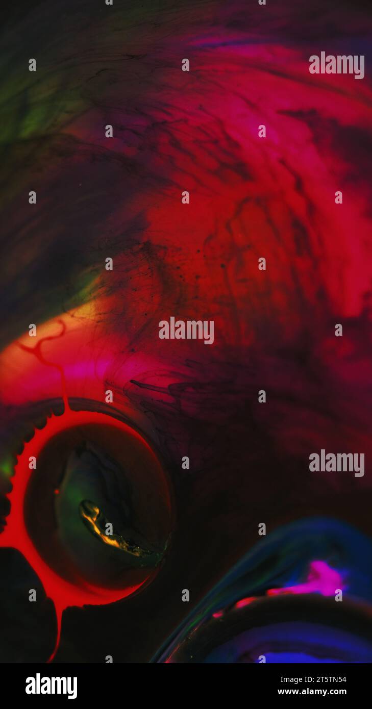 Ink water drop oil bubbles color glitter paint mix Stock Photo - Alamy