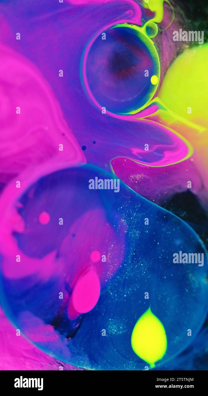 Paint water neon oil bubble color glitter ink mix Stock Photo - Alamy