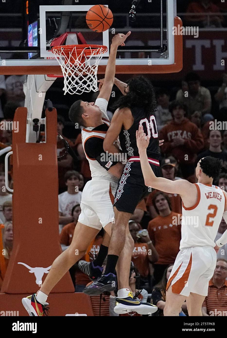 Incarnate Word guard Sky Wicks is blocked by Texas forward Kadin ...