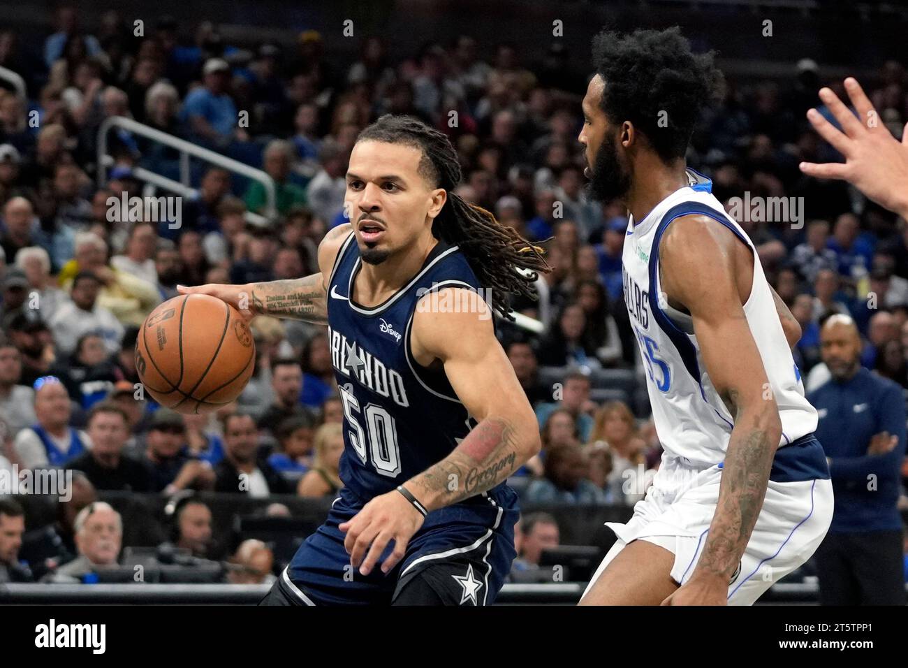 Orlando Magic guard Cole Anthony (50) goes around Dallas Mavericks ...