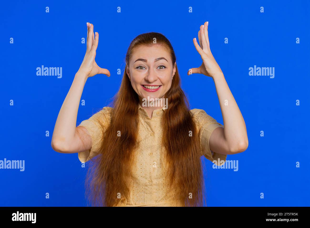 Excited Amazed Woman Touching Head And Showing Explosion Looking
