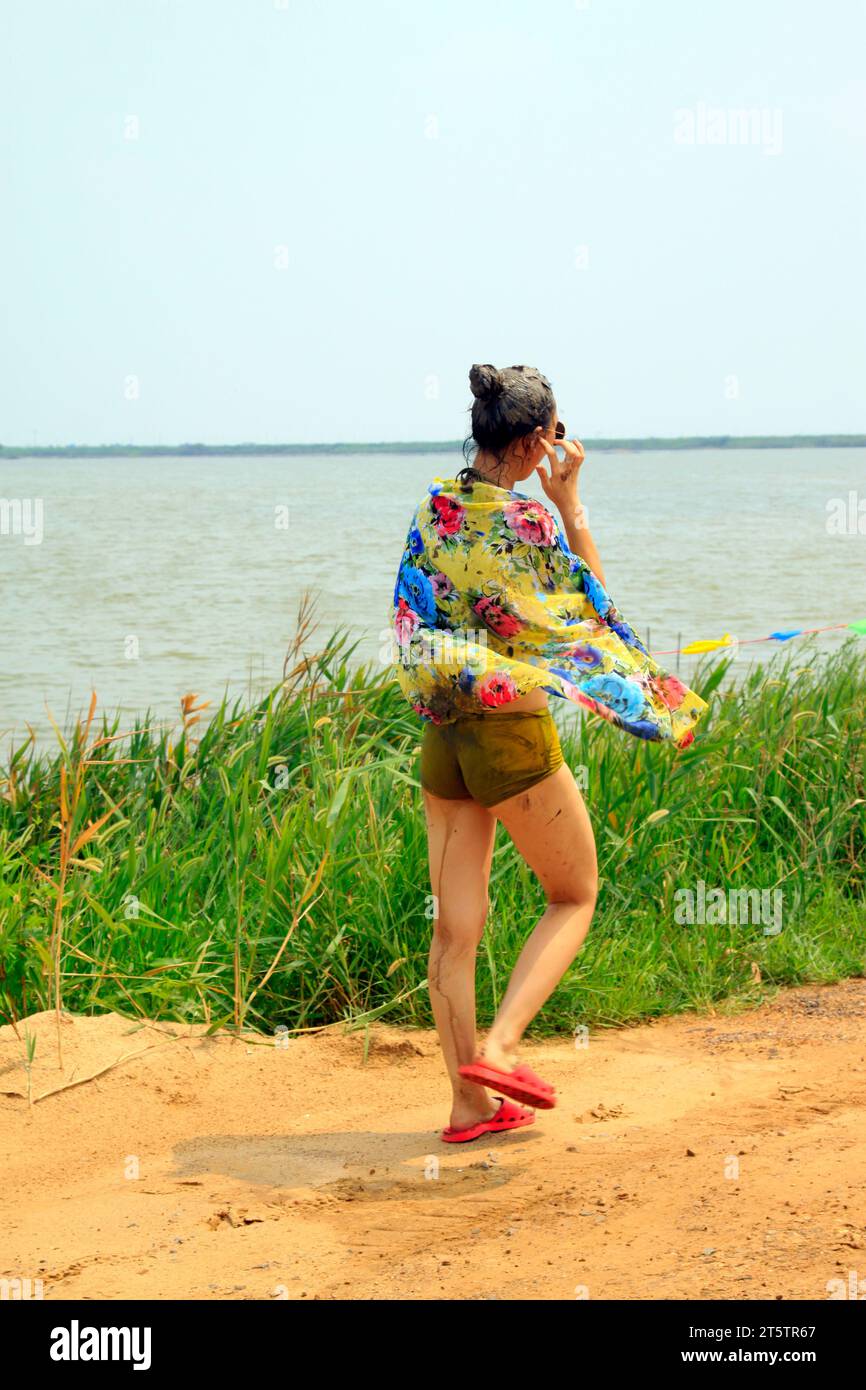 swimsuit woman walk on the embankment Stock Photo - Alamy