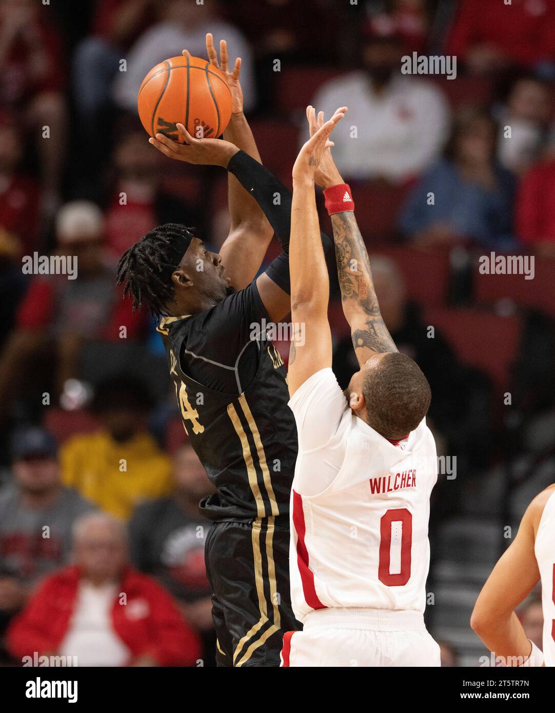 Lindenwood's Keenon Cole, left, shoots against Nebraska's C.J. Wilcher ...