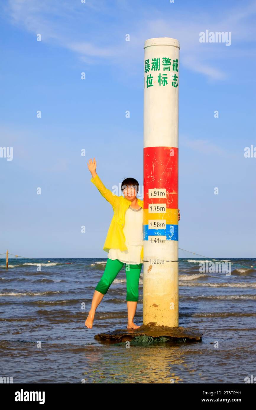JINGTANG PORT - AUGUST 29: a woman visiting nearby storm surge alert ...
