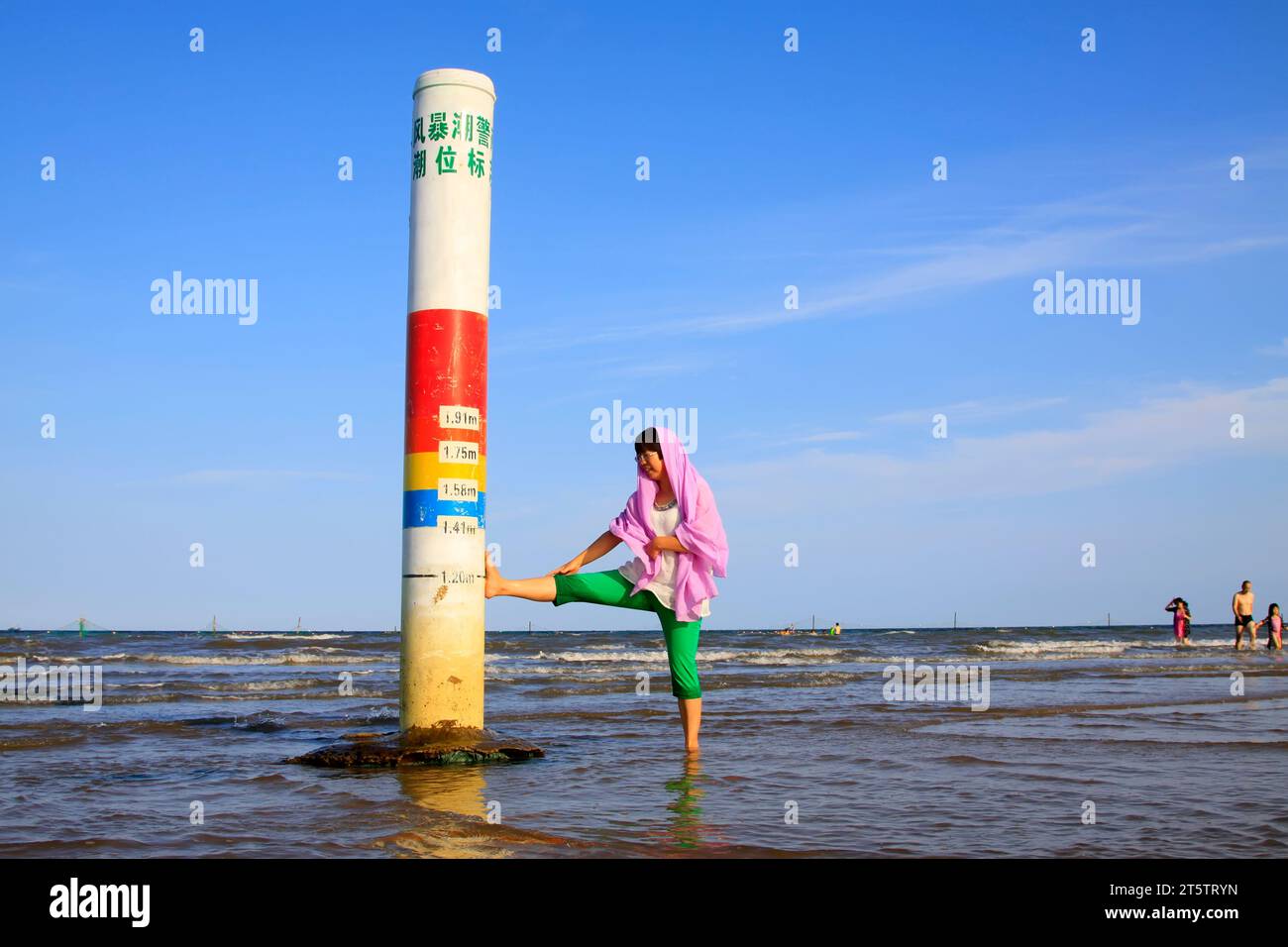 JINGTANG PORT - AUGUST 29: a woman visiting nearby storm surge alert ...
