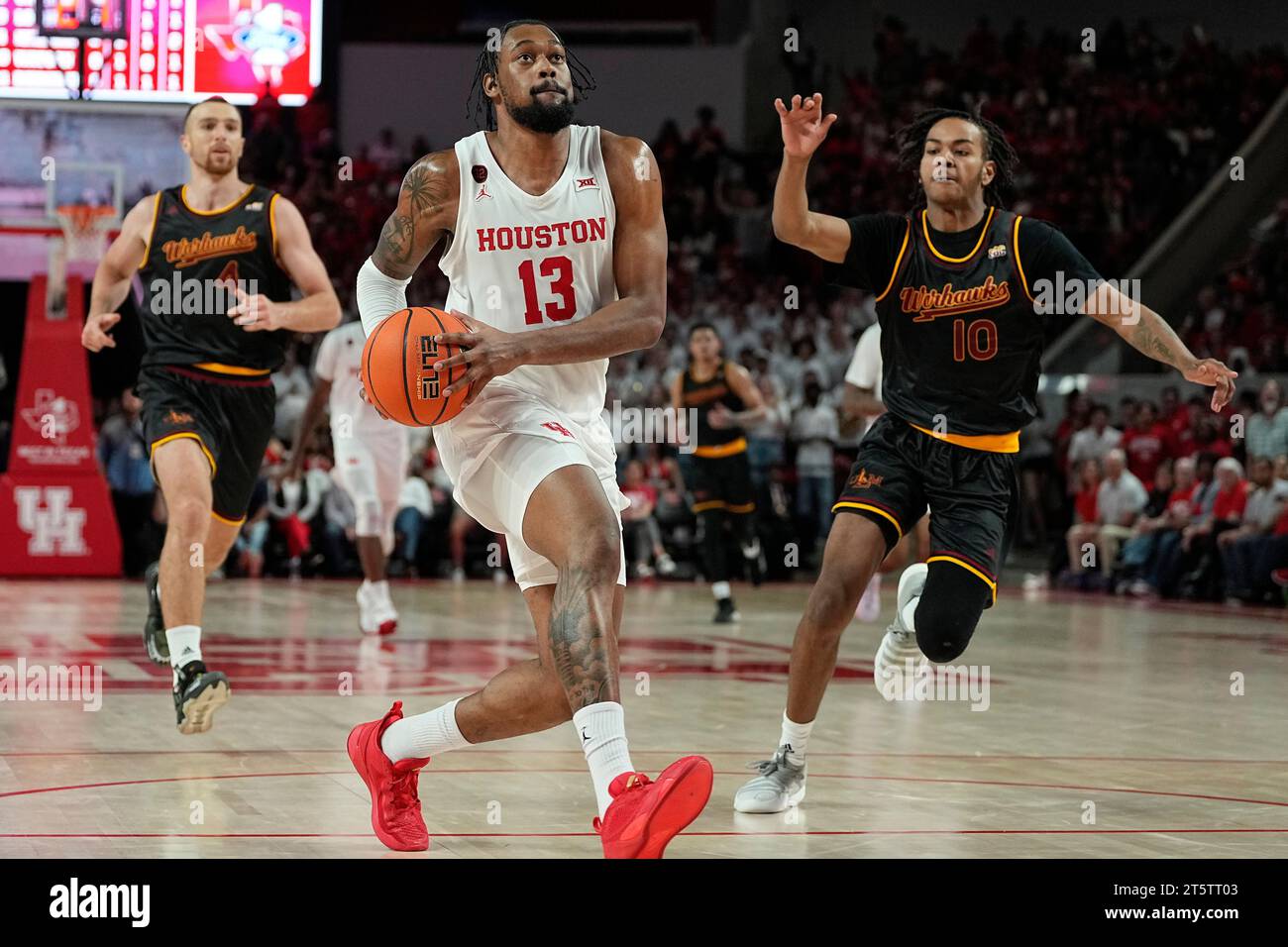 Houston forward J'Wan Roberts (13) drives dow the lane on a fast break ...
