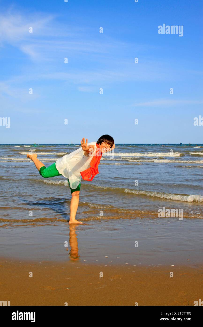 JINGTANG PORT - AUGUST 29: a lady standing at the sea beach, on August ...