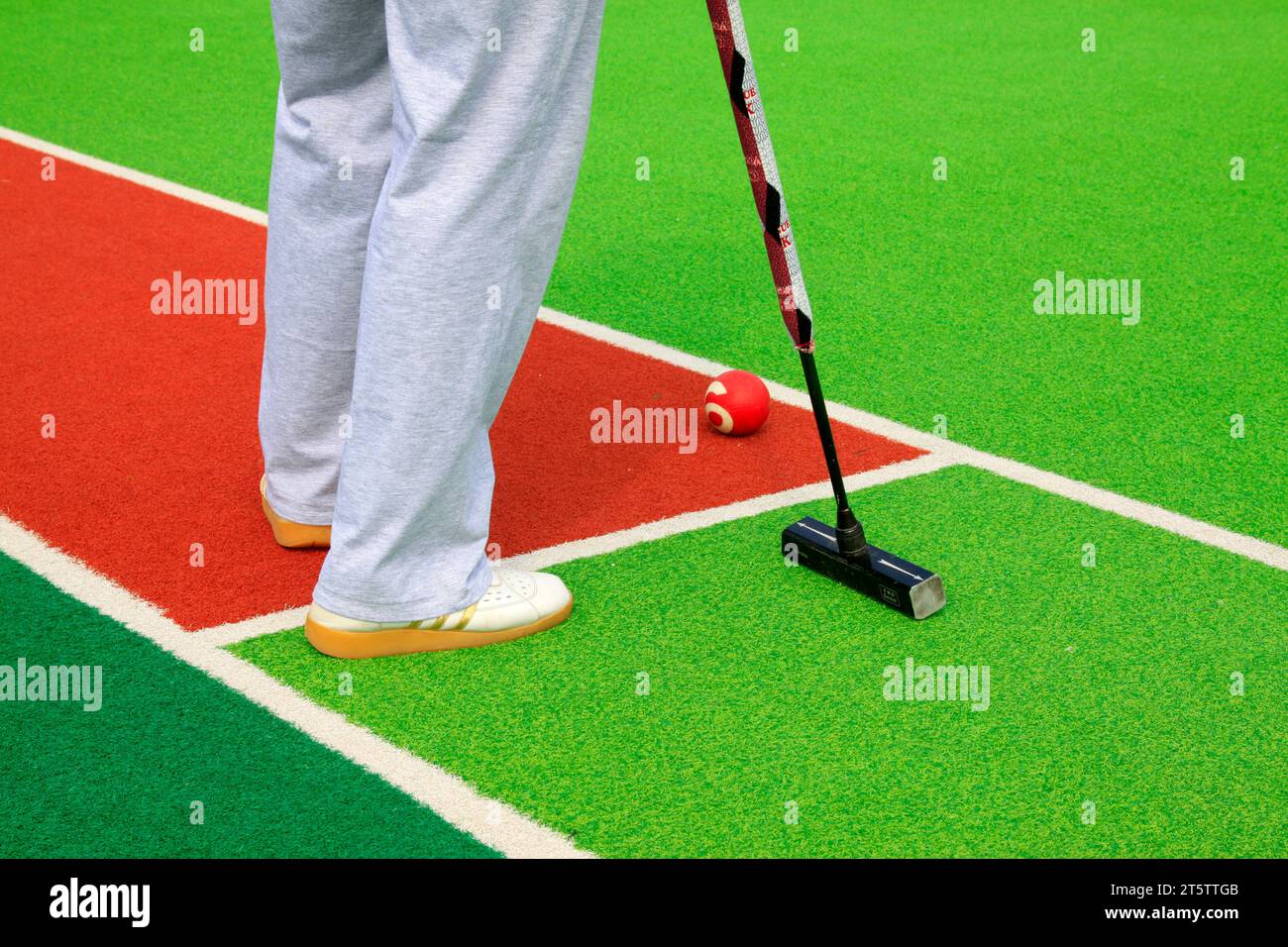 Chinese gate ball ball arm and athlete's legs, closeup of photo Stock ...